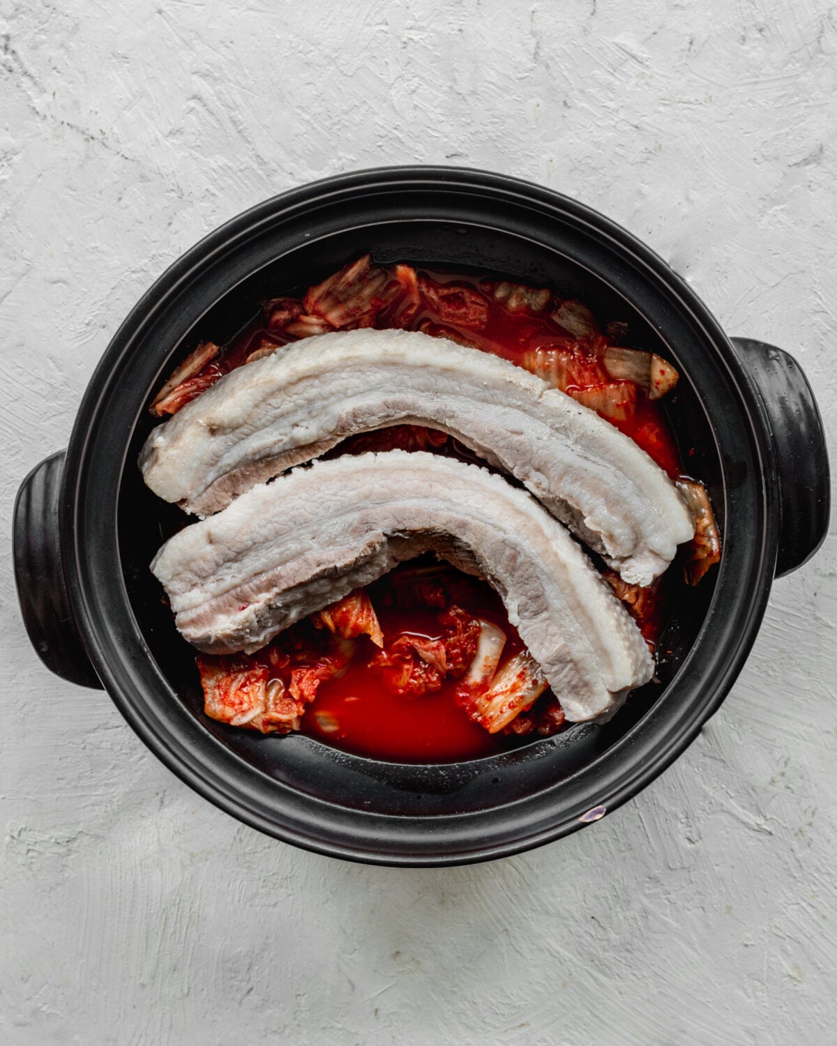 Braised Kimchi with Pork Belly + Tofu (Kimchi Jjim) | The Subversive Table